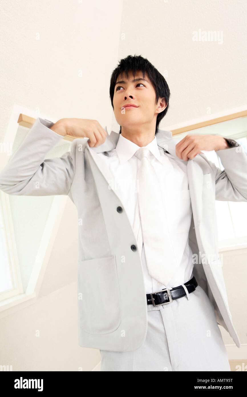 Worker putting on a jacket hi-res stock photography and images - Alamy