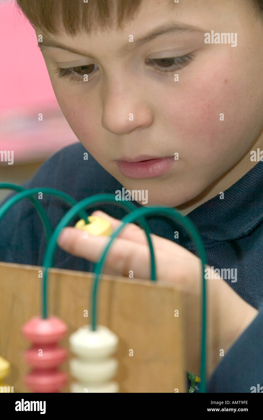 Boy using an abacus at primary school in England Stock Photo - Alamy