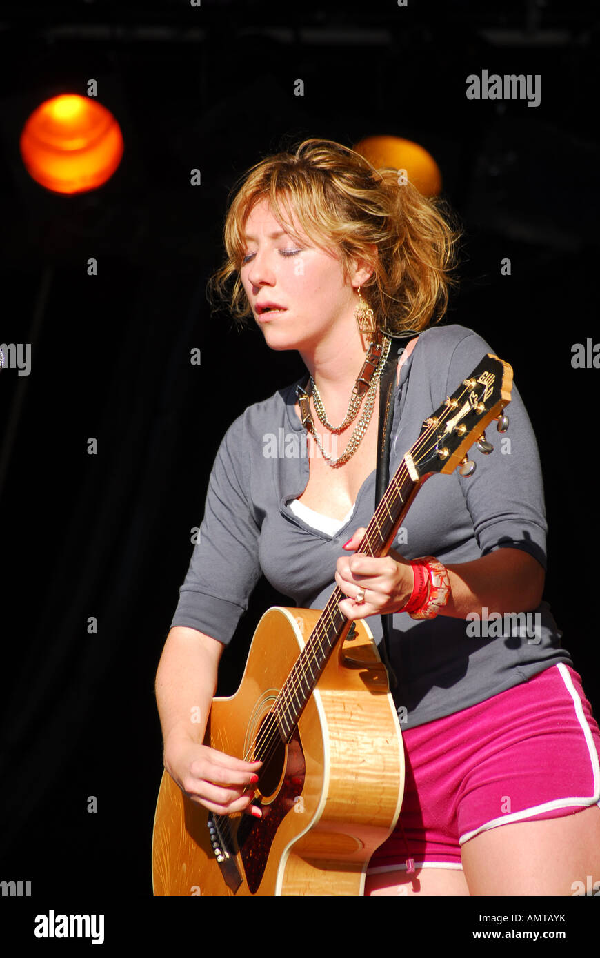 Martha Wainwright on stage singing and playing guitar at Wychwood ...