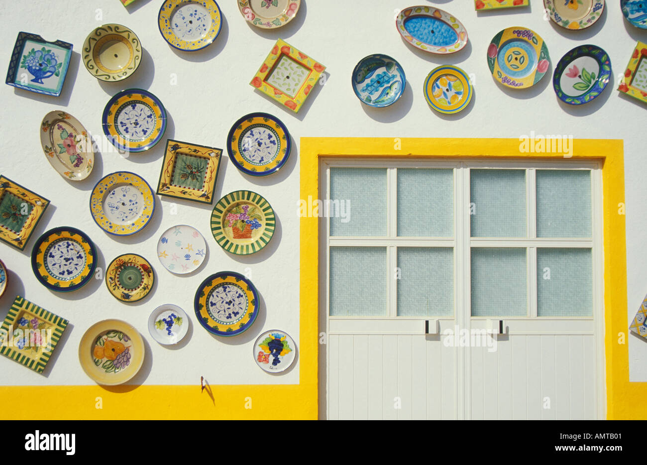 Traditional portuguese plates on an artisan pottery wall Sagres Algarve ...