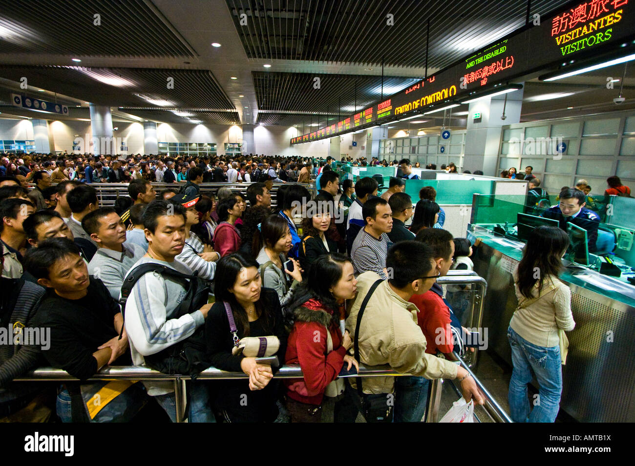 Chinese People Wait to Enter Macau at the Border Crossing Between Macau ...