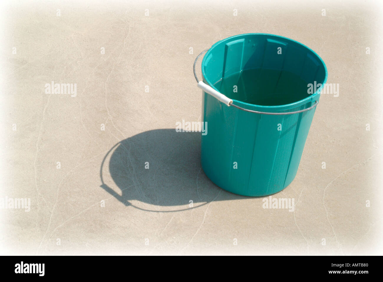 bucket on a sandy beach Stock Photo - Alamy