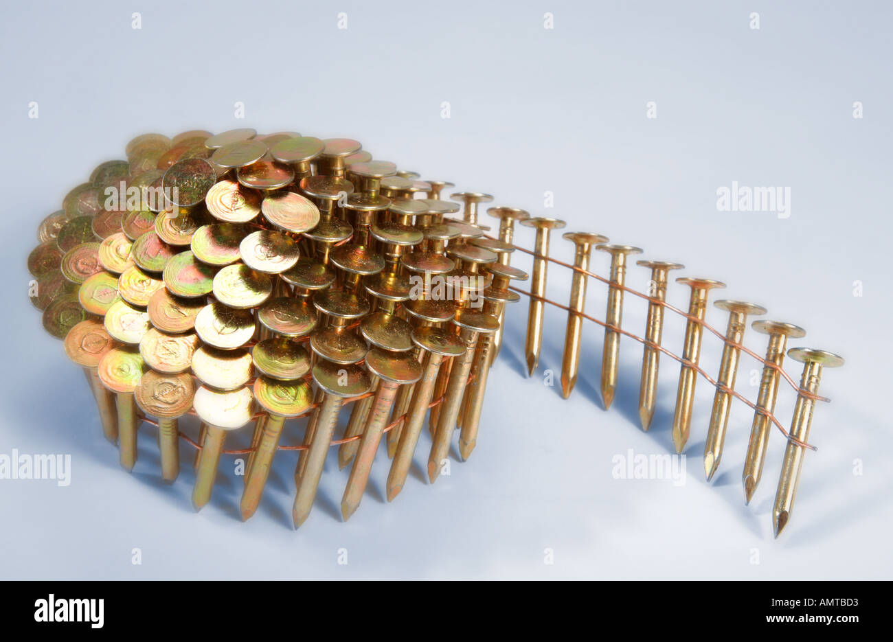 A roll of nails made for a builder's nail gun Stock Photo - Alamy