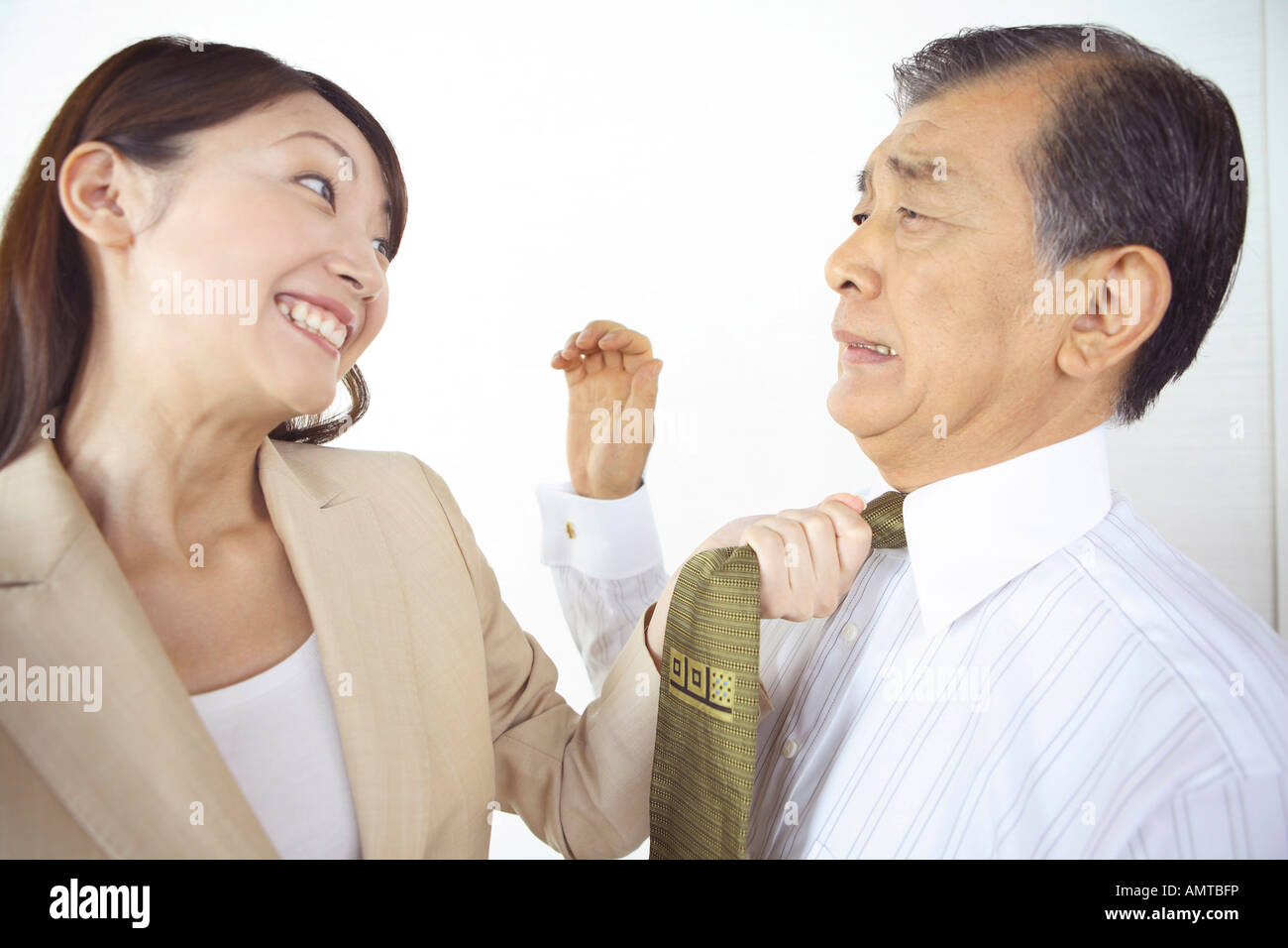 Man woman grabbing tie hi-res stock photography and images - Alamy