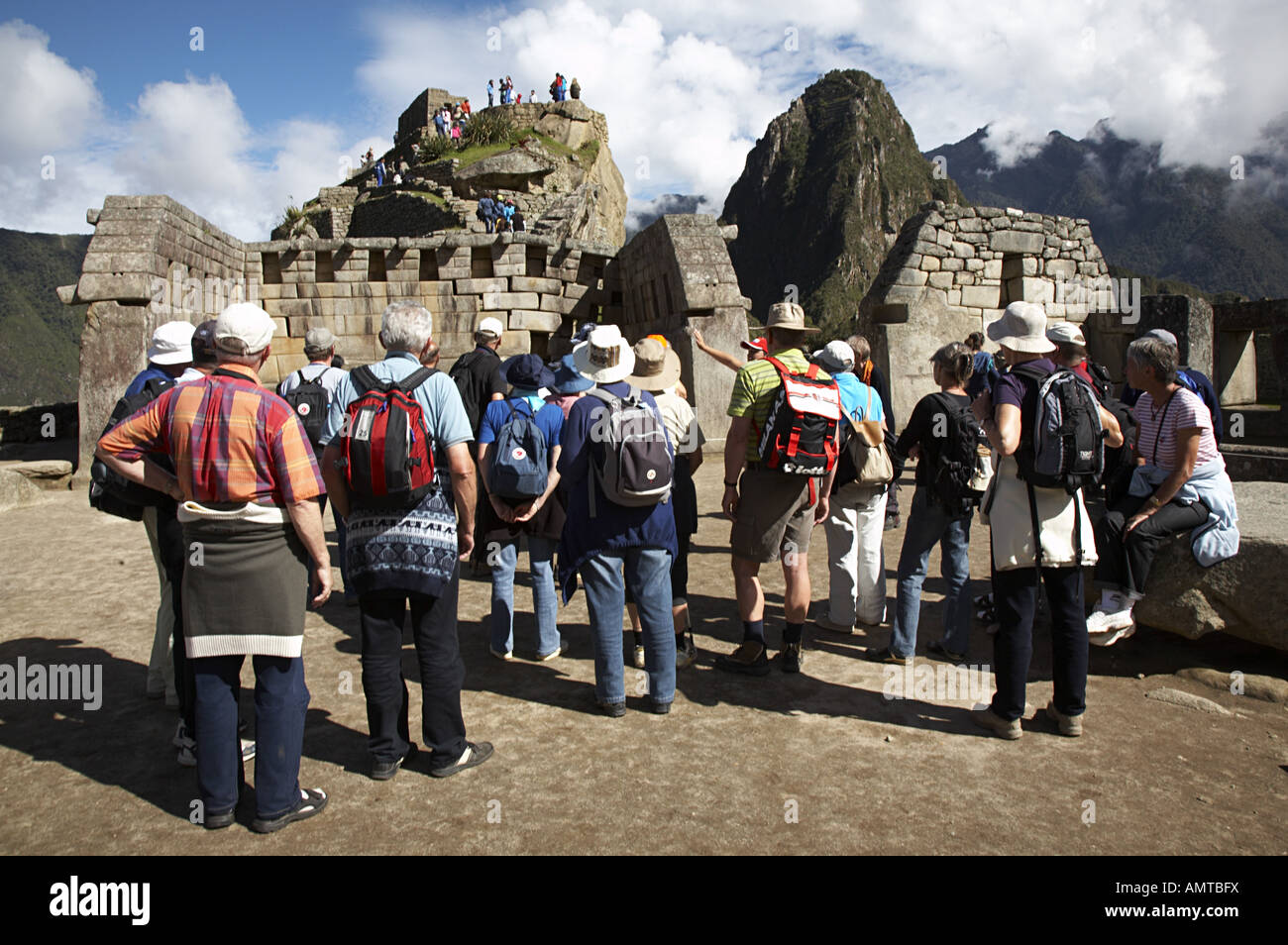 Tourists taking photos at the ruins of Machu Picchu Peru Stock Photo ...