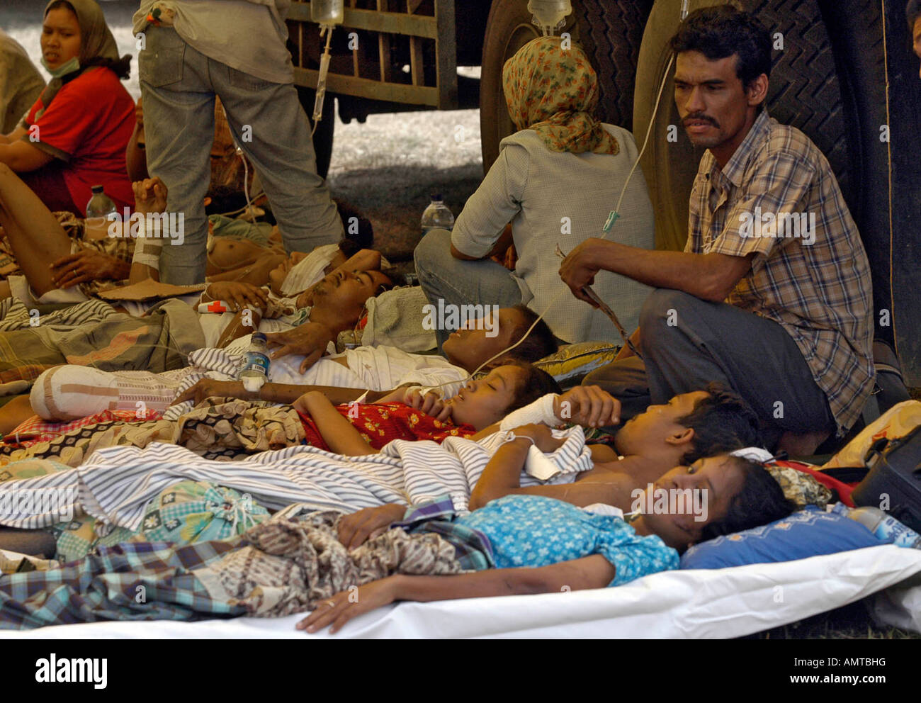 Tsunami injured persons receive medical care at the airforce base at ...