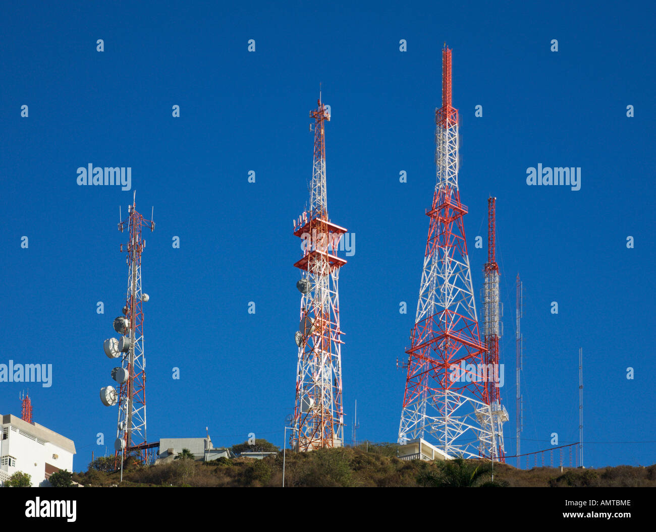 Complex of Telecommunication masts against deep blue sky at the port ...
