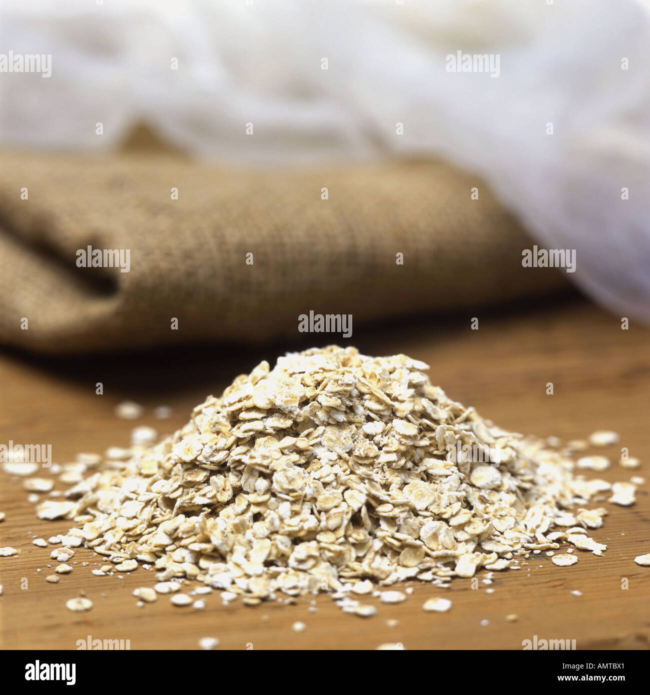 Pile of oats on wooden surface Stock Photo - Alamy