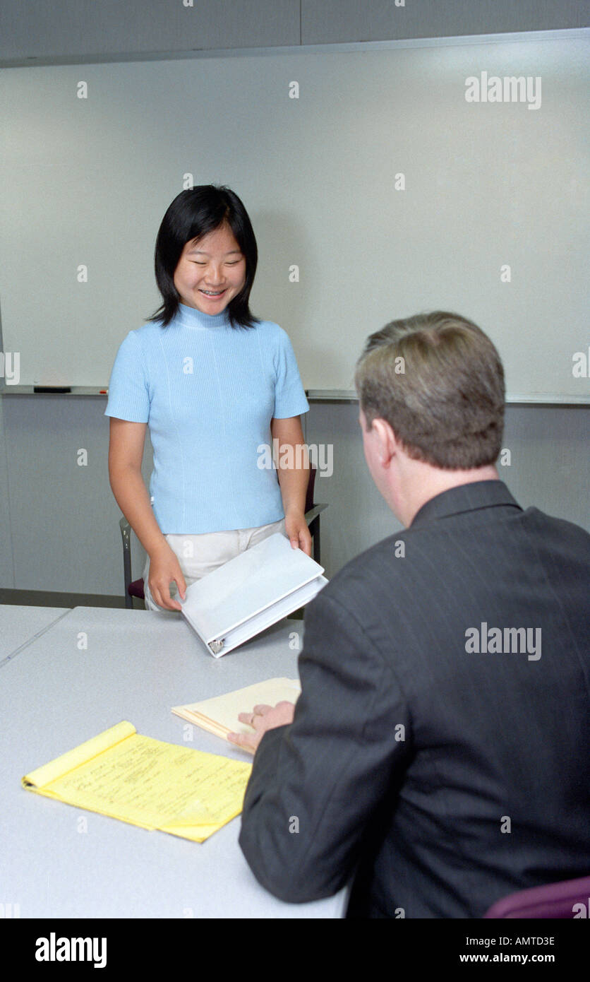 Students work in high school business careers class on the skills of ...