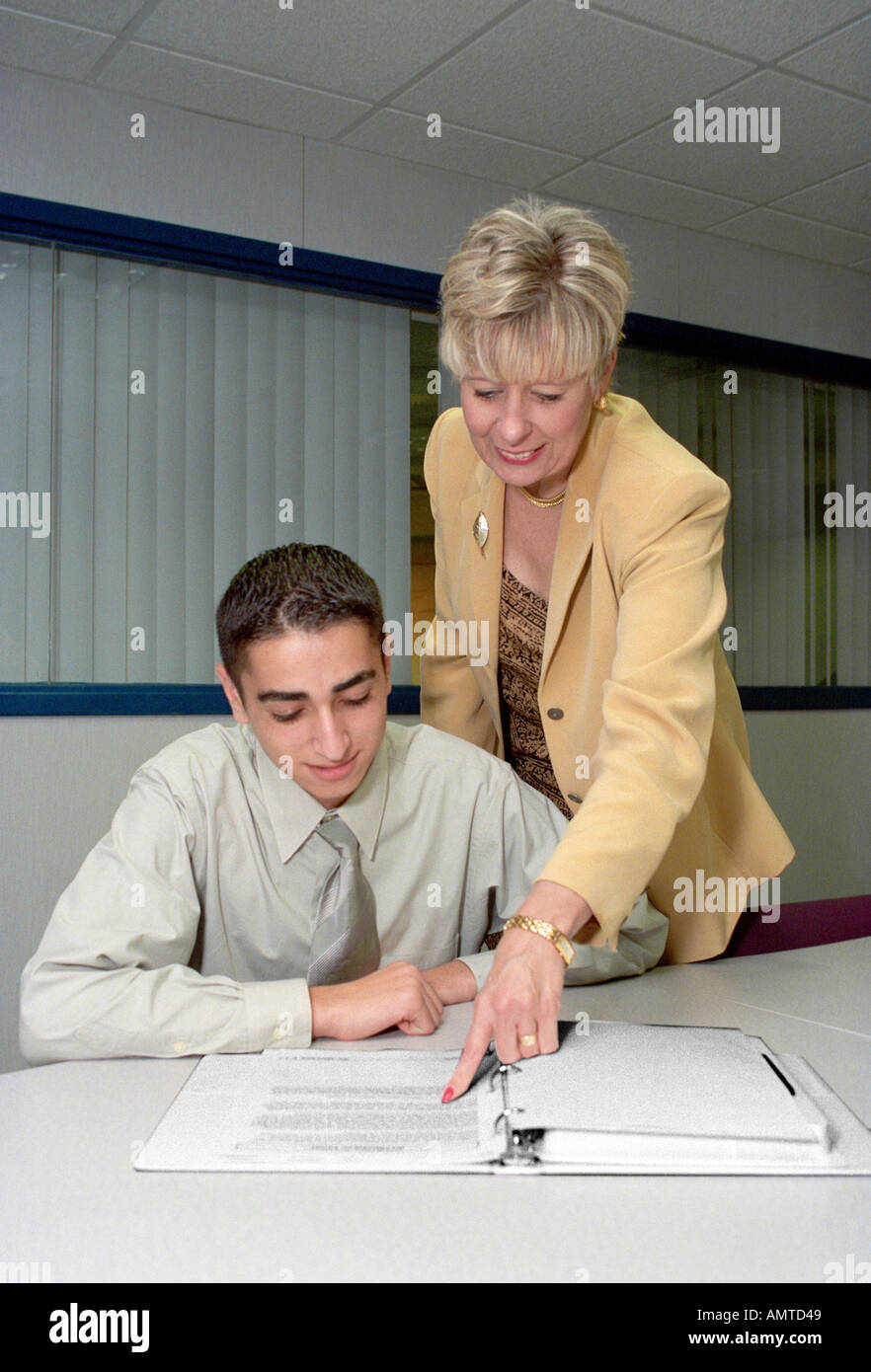 Students work in high school business careers class on the skills of ...