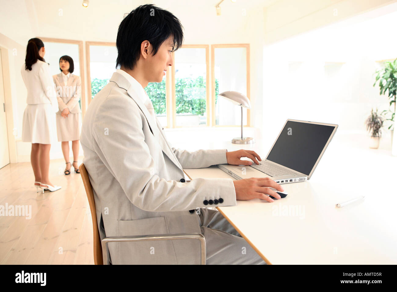 Office worker operating a PC Stock Photo - Alamy