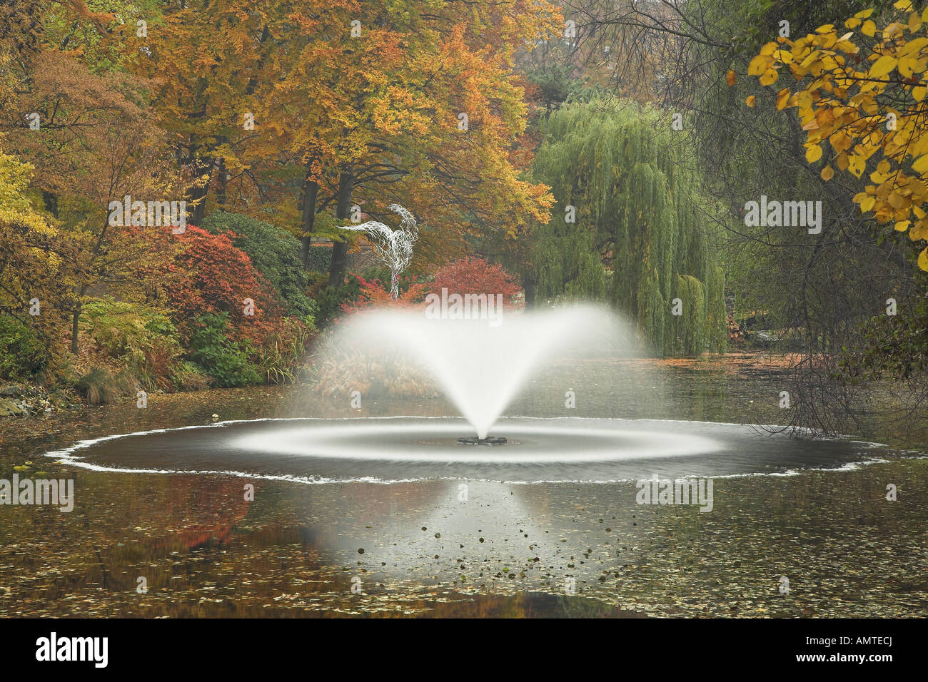 Fountain in autumn Stock Photo - Alamy