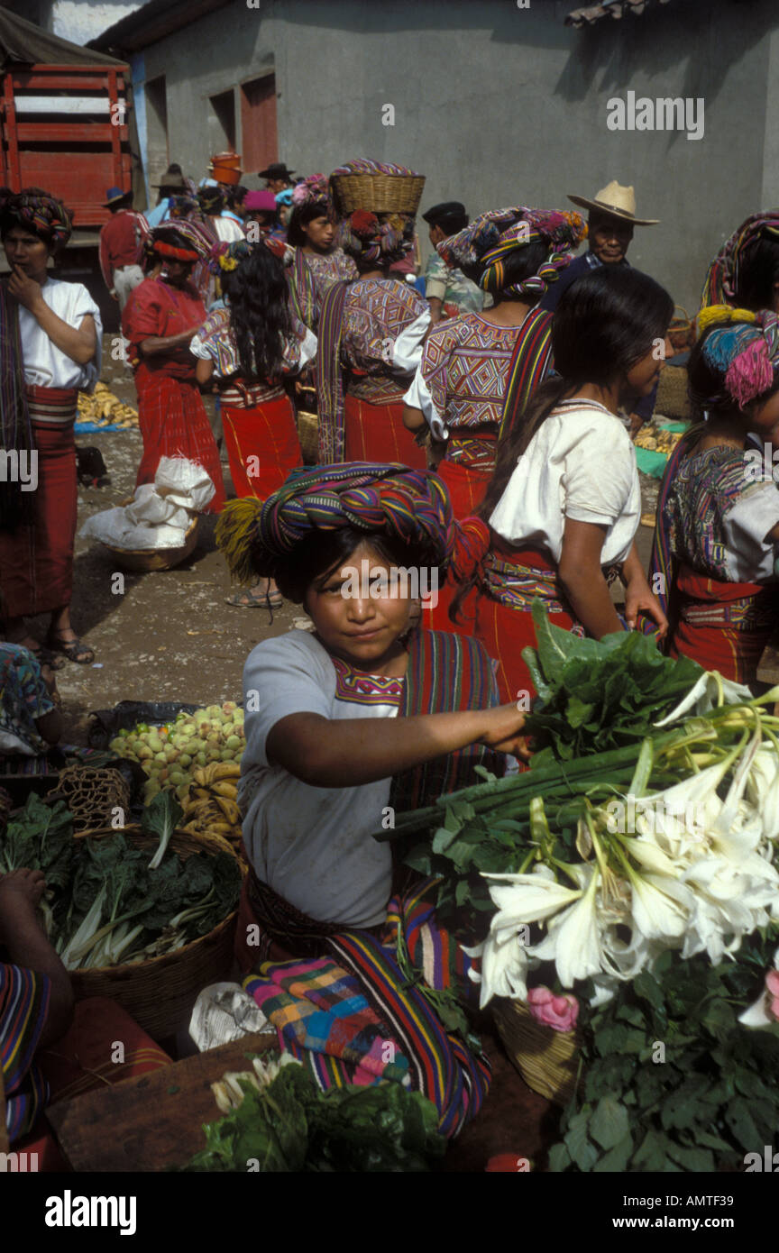Street market with women dressed in typical local dresses Guatemala ...
