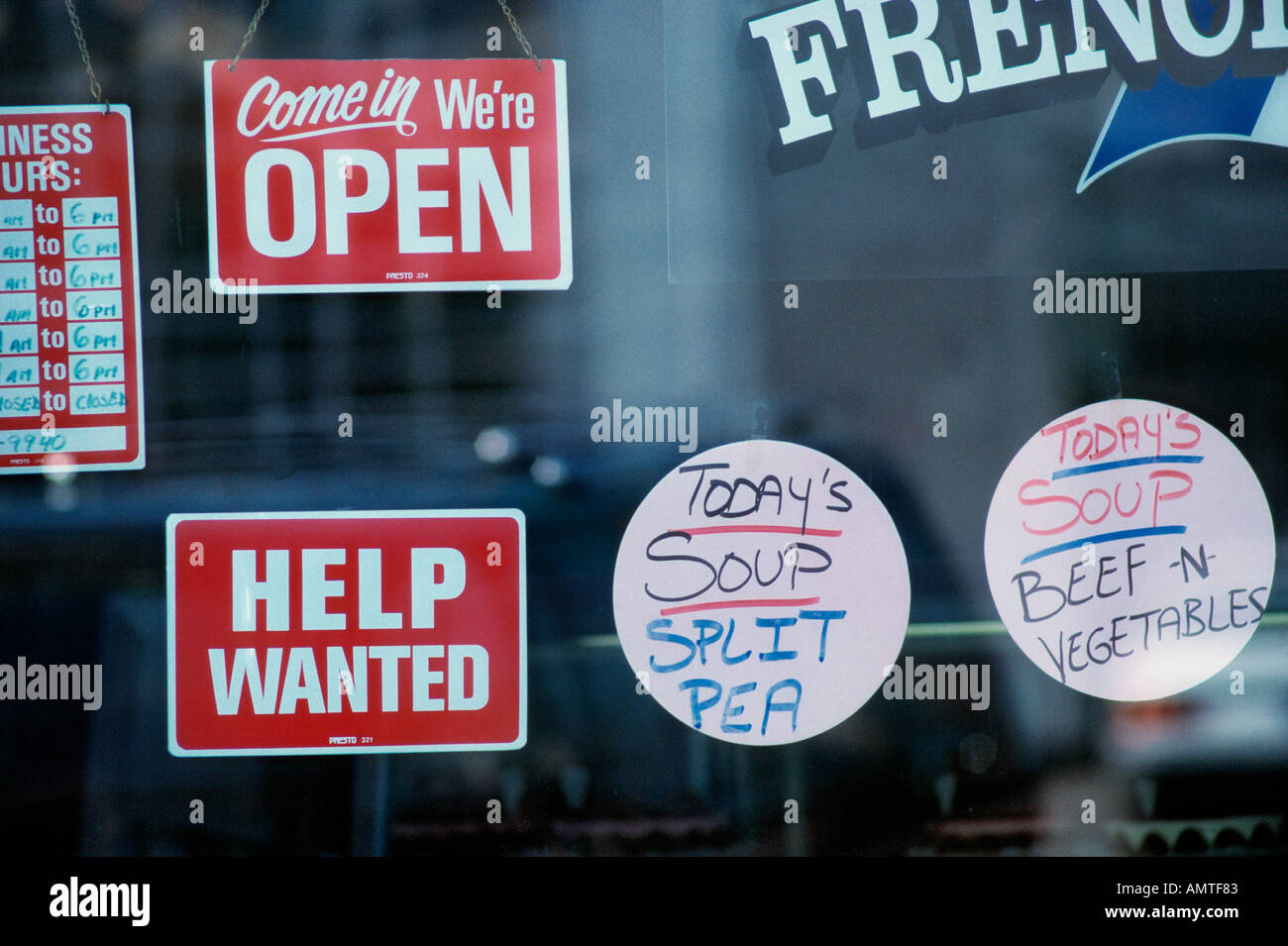 Variety of signs in restaurant window Stock Photo - Alamy