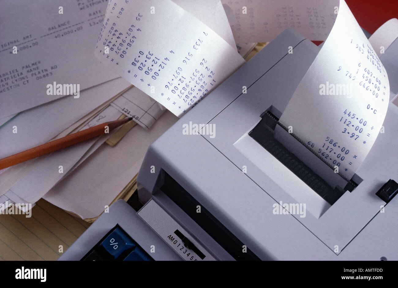 Adding machine calculating figures and printing tape Stock Photo - Alamy