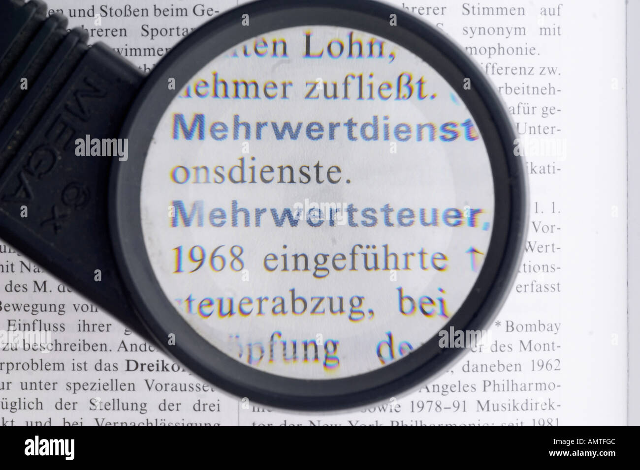 VAT, value added tax , german word, magnifying glass Stock Photo - Alamy