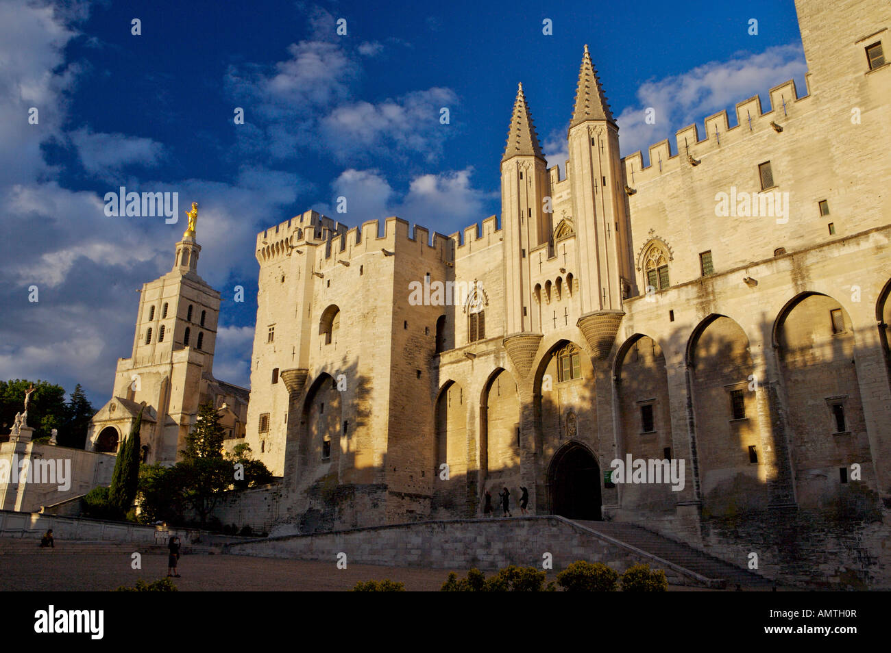 Palais des Papas along Place du Palais in the medieval walled city of ...