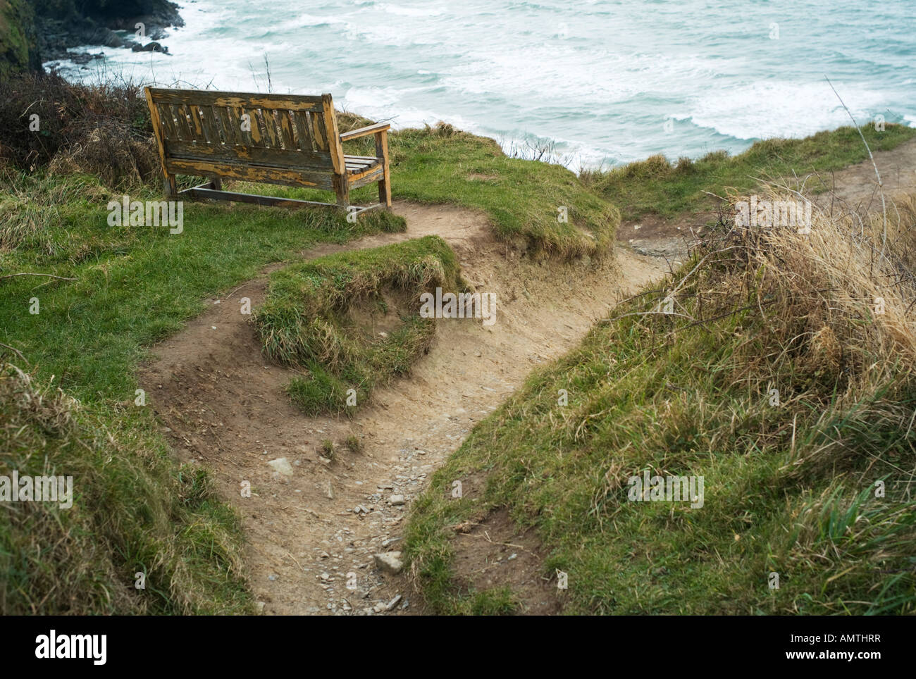Heavily eroded coastal footpath approaching Llangrannog village on the ...