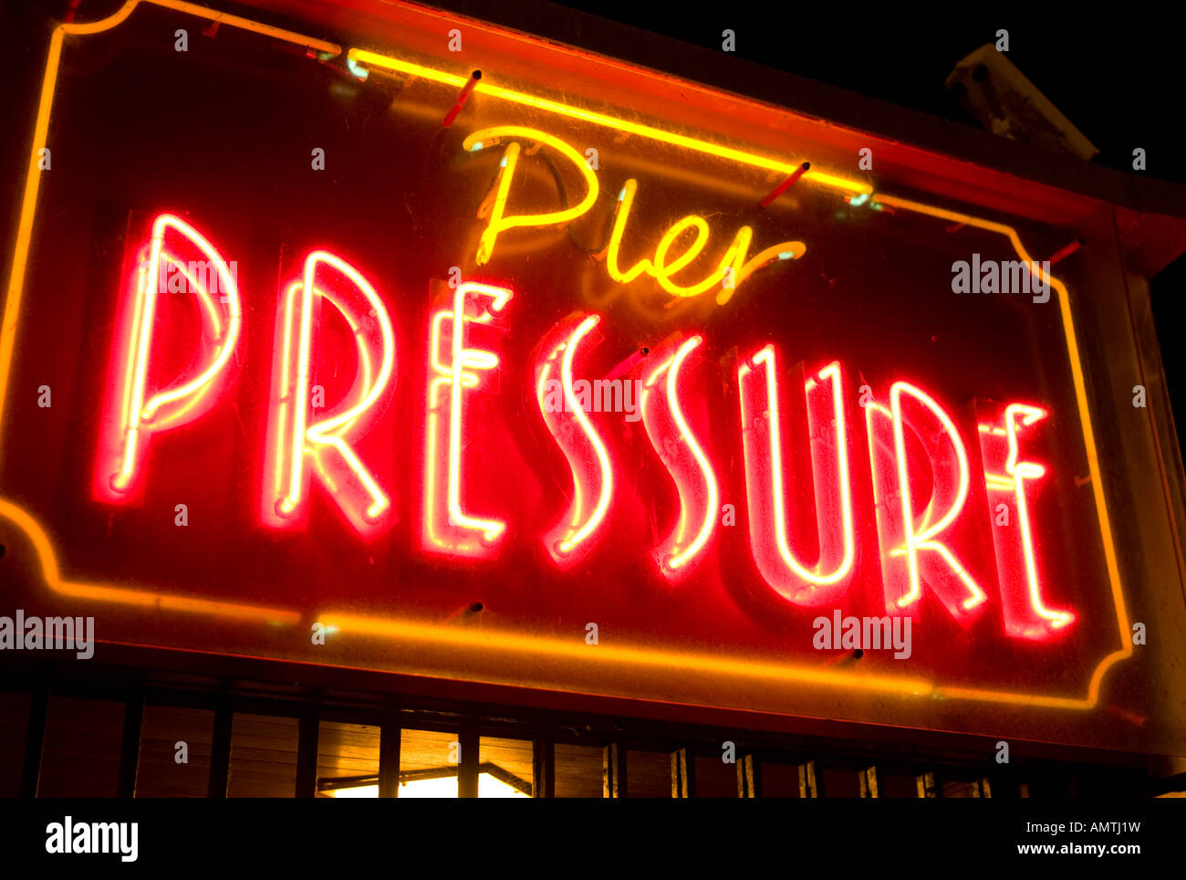 Pier Pressure punning illuminated neon sign outside night club on ...