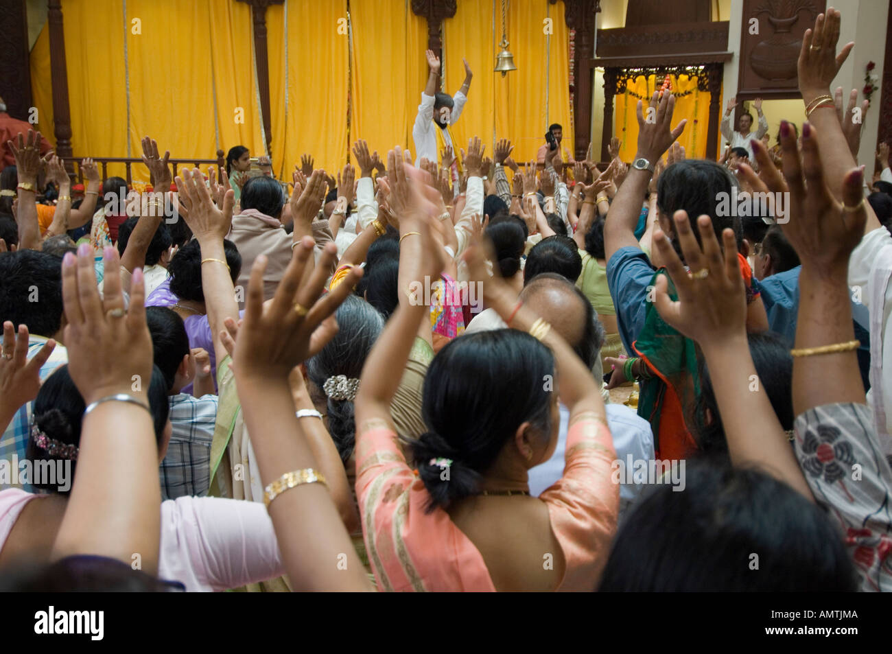 People chanting at Hindu temple ceremony Stock Photo - Alamy