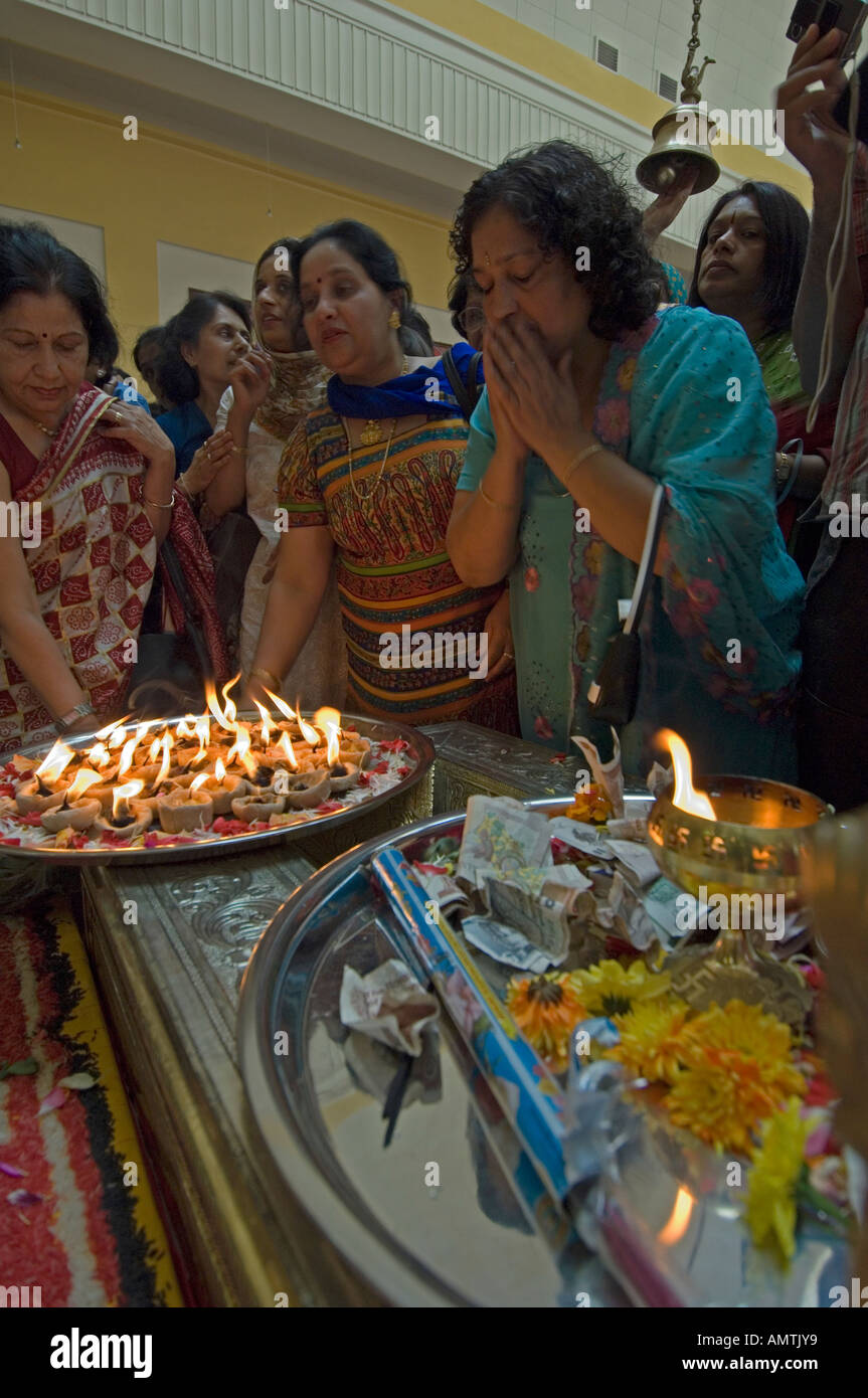Worshippers in Hindu temple offering money and food Stock Photo - Alamy