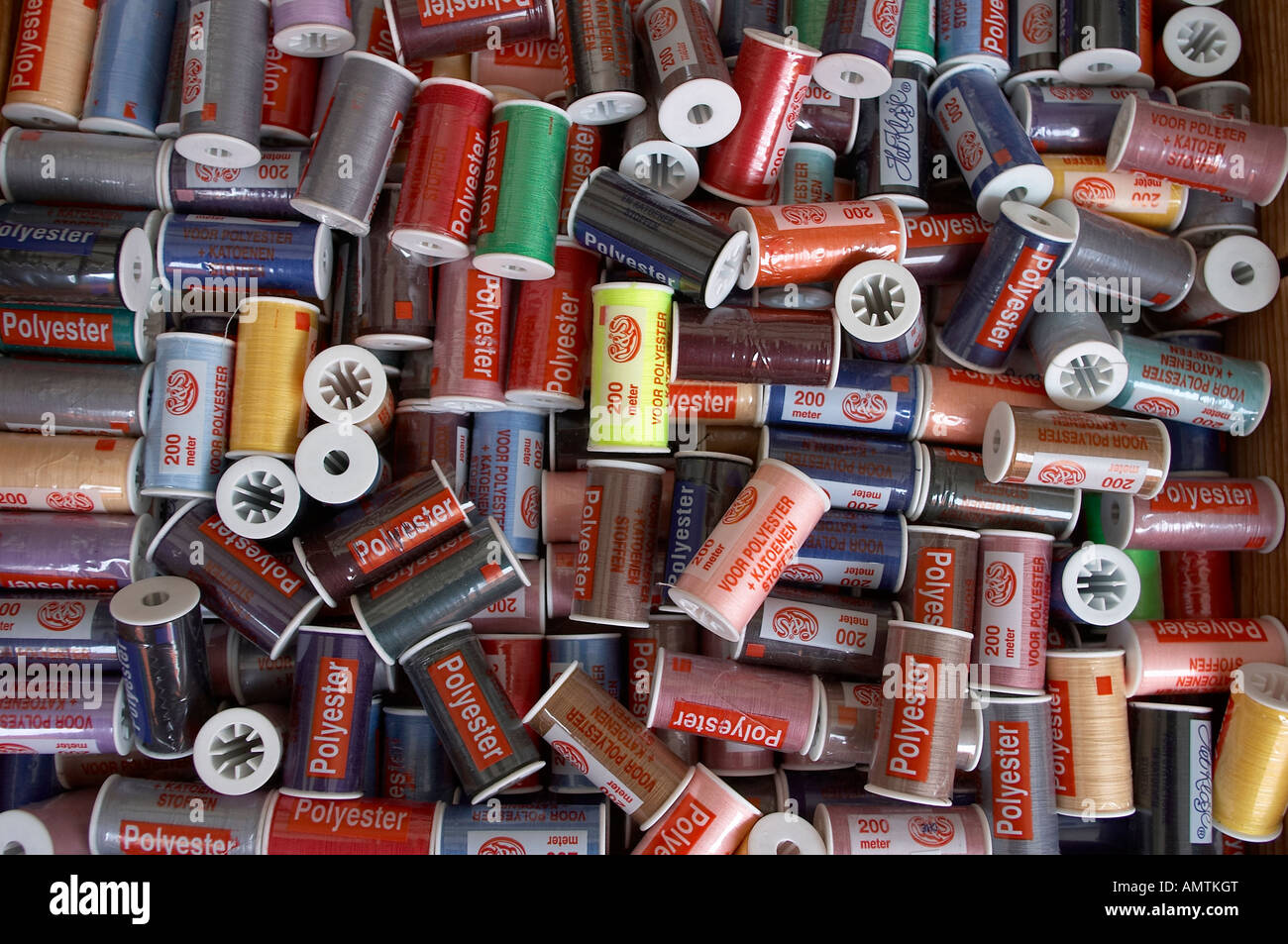 Close-up view with different colored spools of thread Stock Photo - Alamy