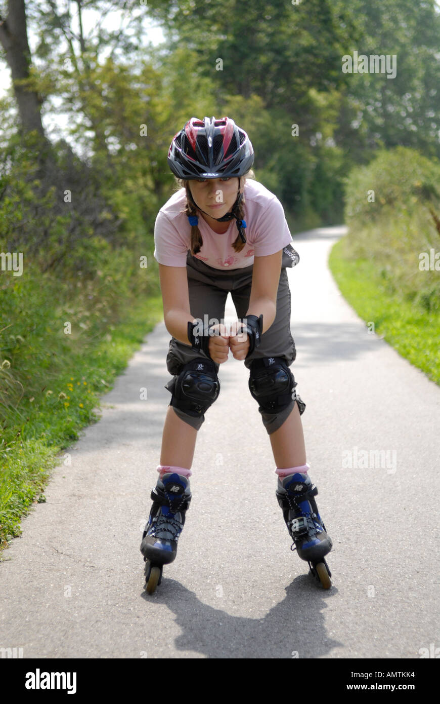 girl runs with inline skates Stock Photo - Alamy