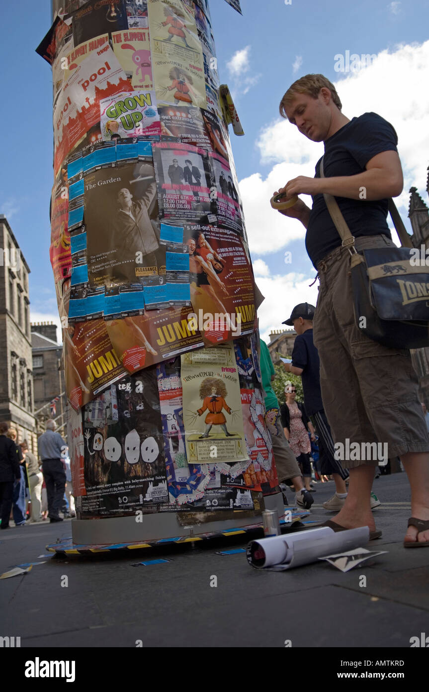 Man sticking posters hi-res stock photography and images - Alamy