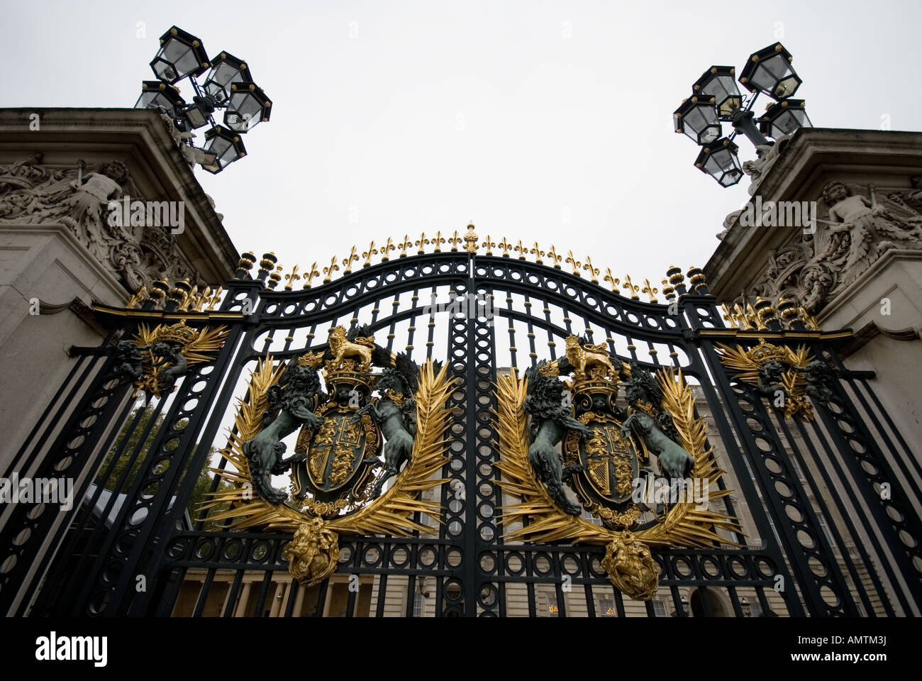 Buckingham Palace gate with gold logos London Stock Photo - Alamy