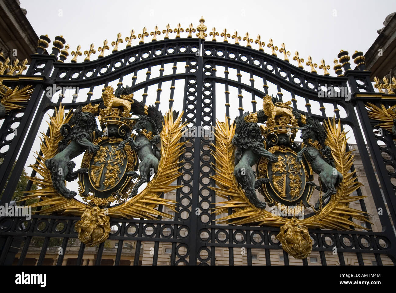 Buckingham Palace gate with gold logos London Stock Photo - Alamy
