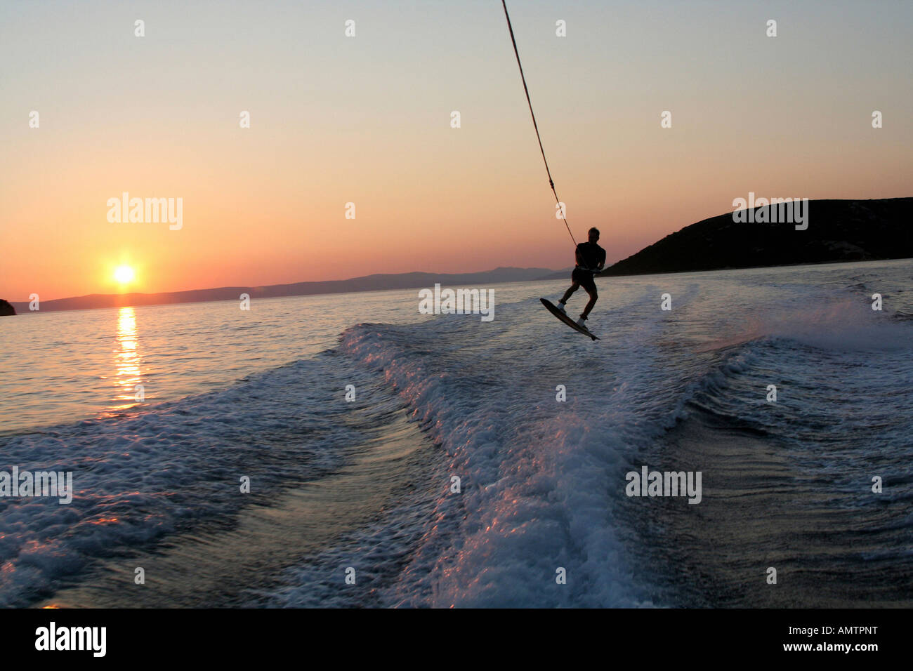 A wakeboarder at sunset Stock Photo - Alamy