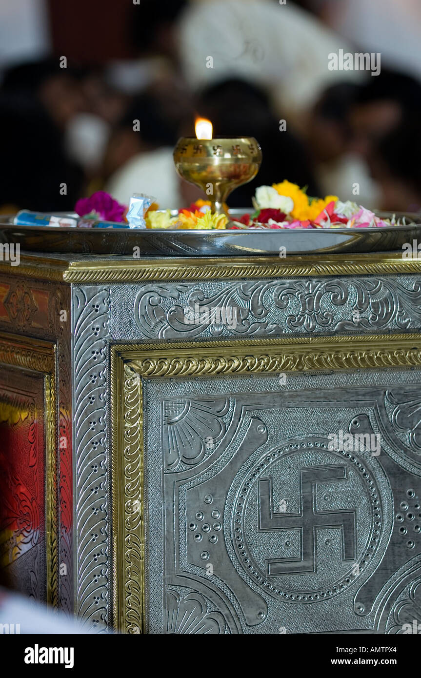 Candle and offerings at Hindu temple Stock Photo - Alamy