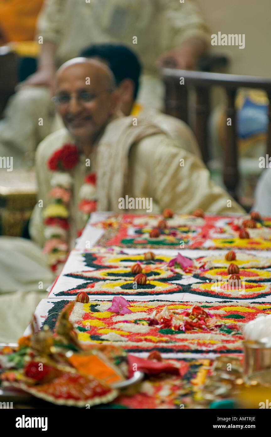 Flower petals and coloured rice decorations at Hindu temple ceremony ...