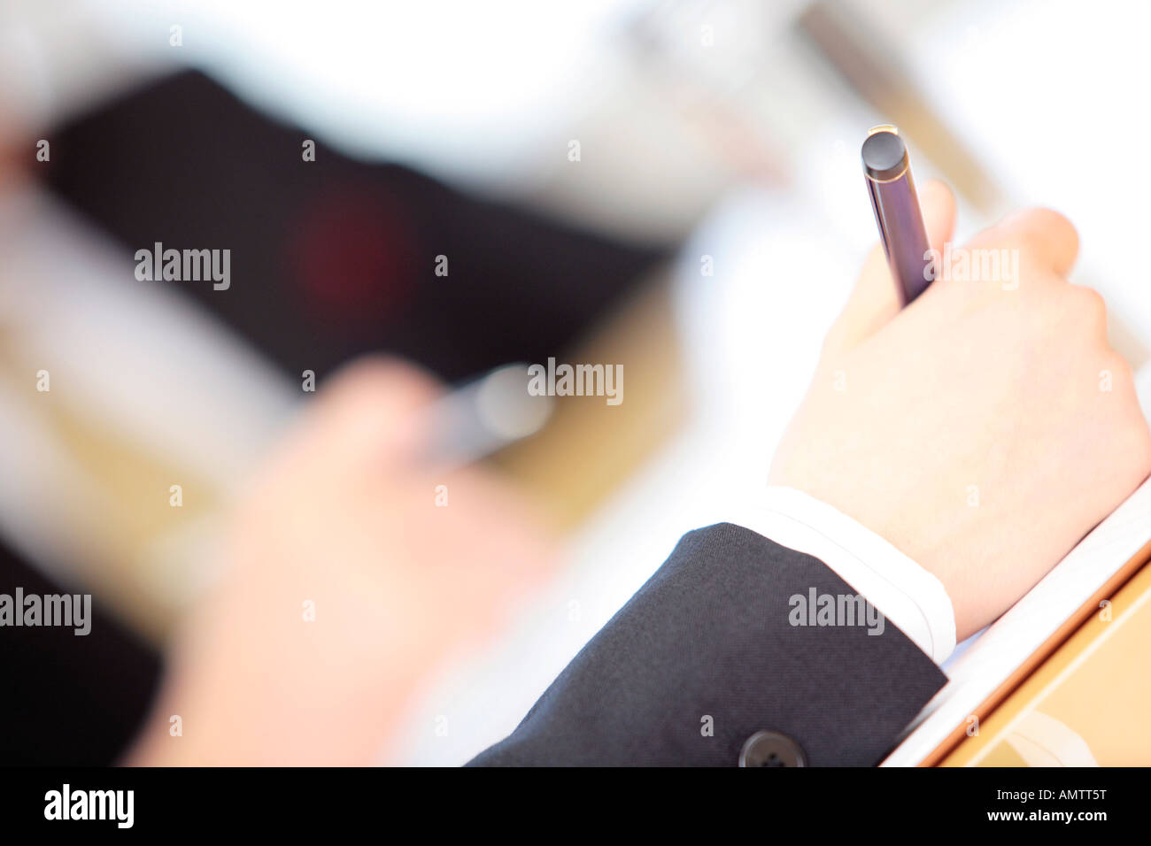 Hand taking a memo Stock Photo - Alamy