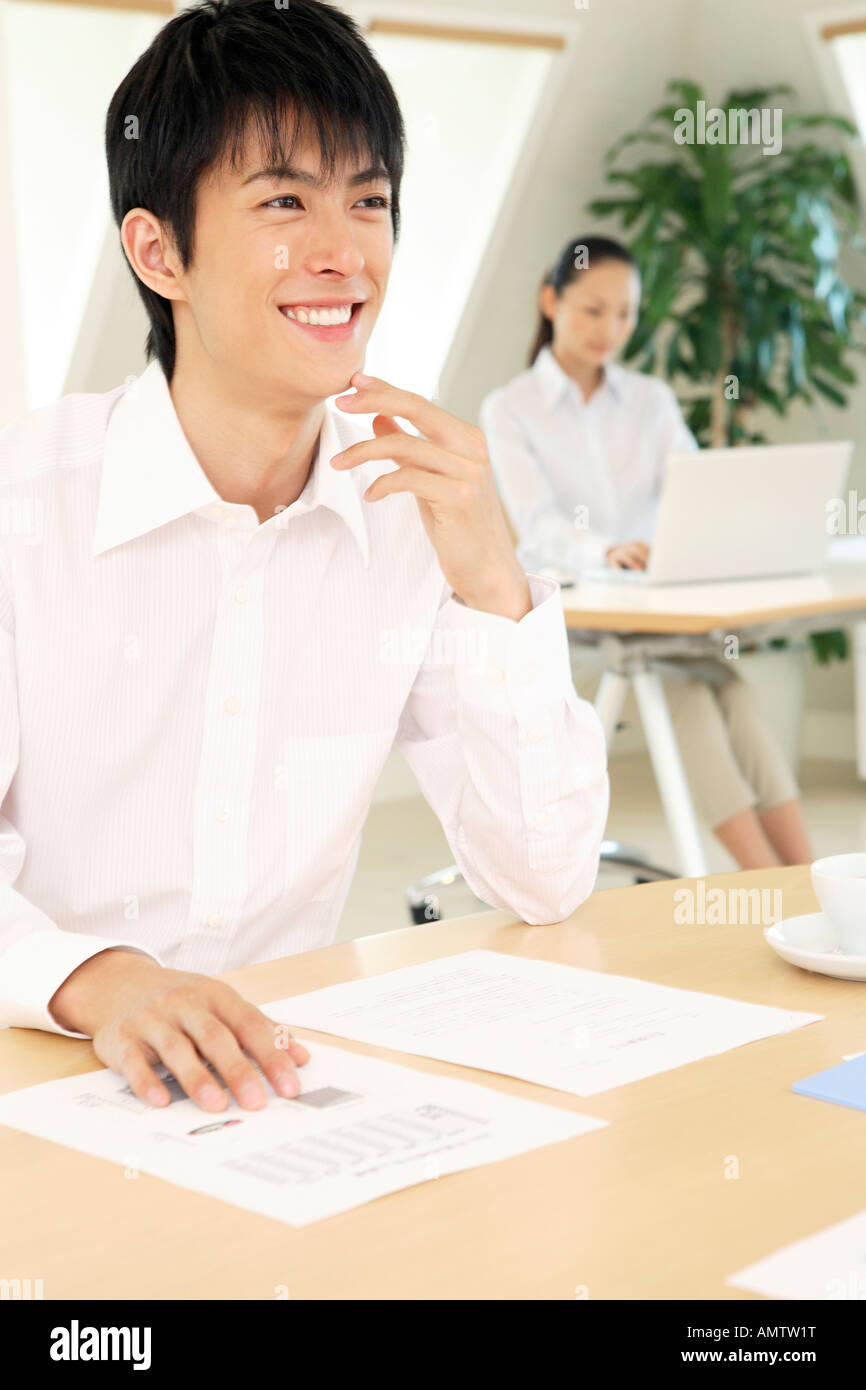 Smiling Japanese office worker Stock Photo - Alamy