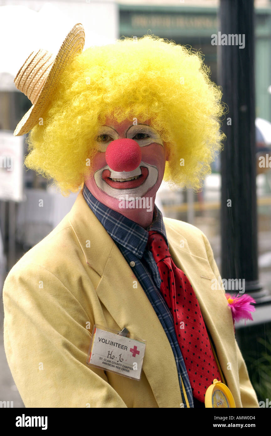 Portrait of a clown in a colorful costume Stock Photo - Alamy