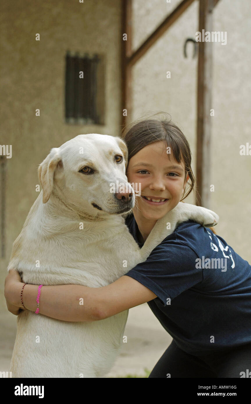 girl and young Labrador Retriever dog Stock Photo - Alamy