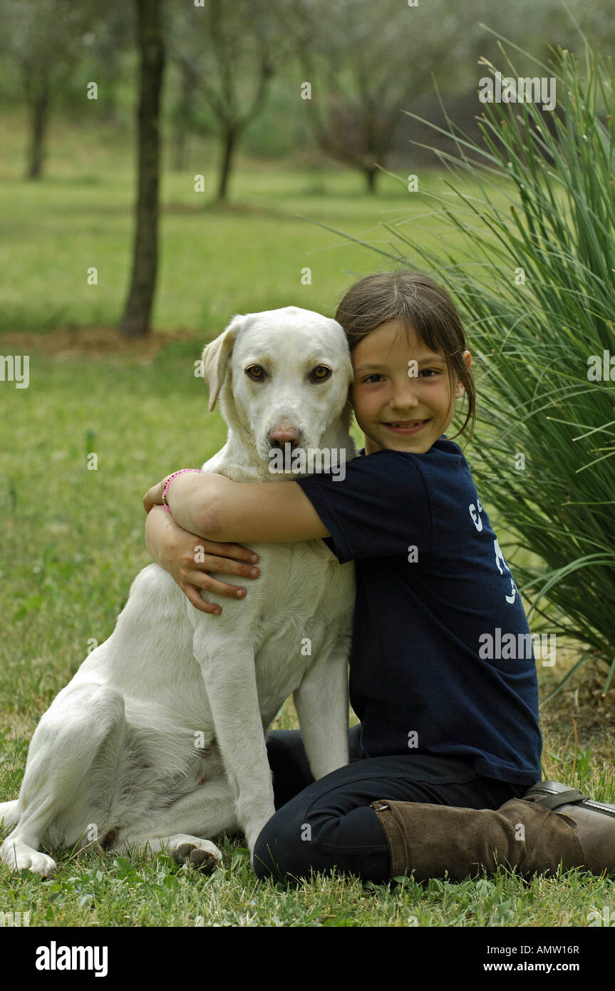 girl and young Labrador Retriever dog Stock Photo - Alamy