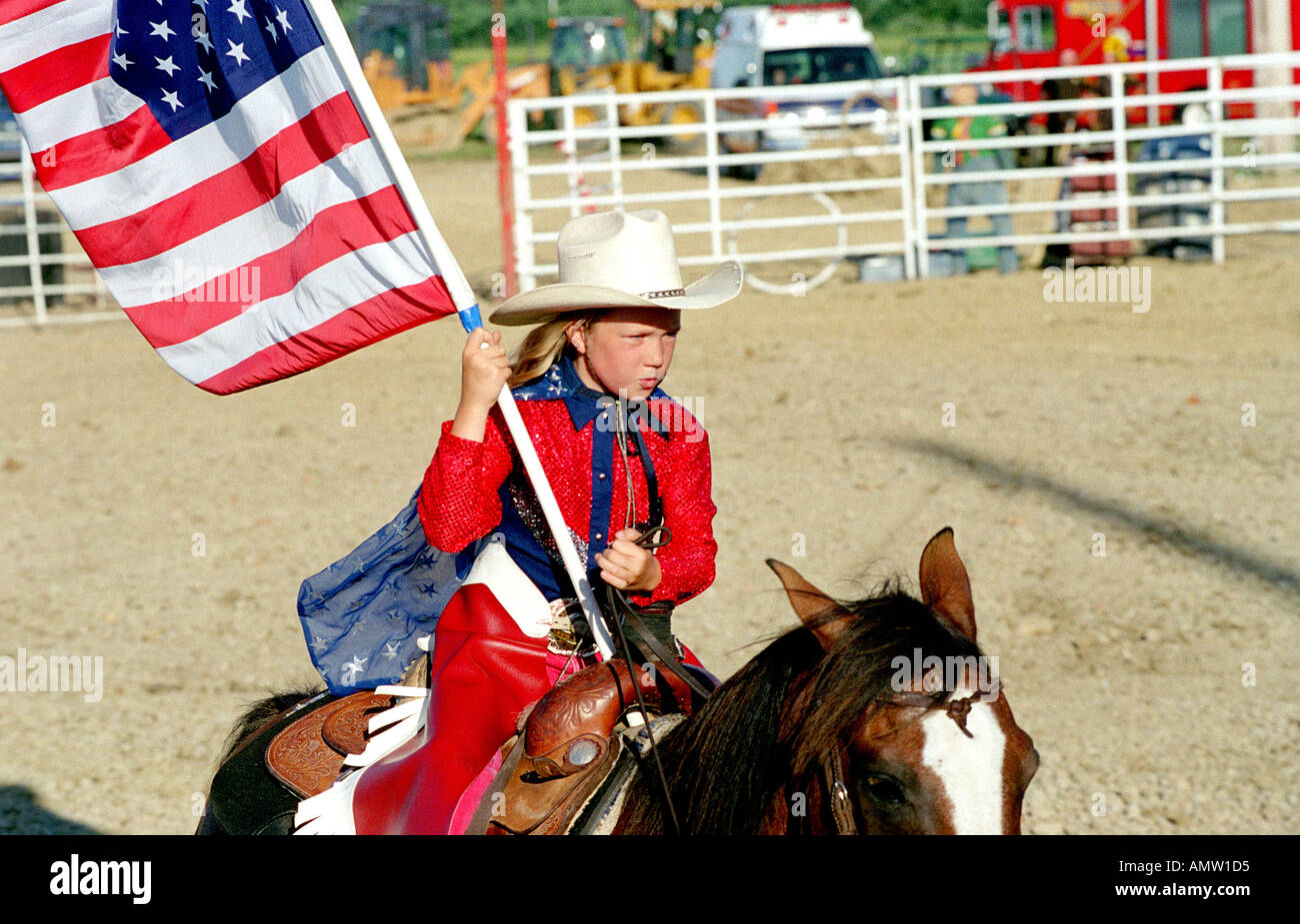Teen female flag bearer in opening ceremonies of rodeo Stock Photo - Alamy