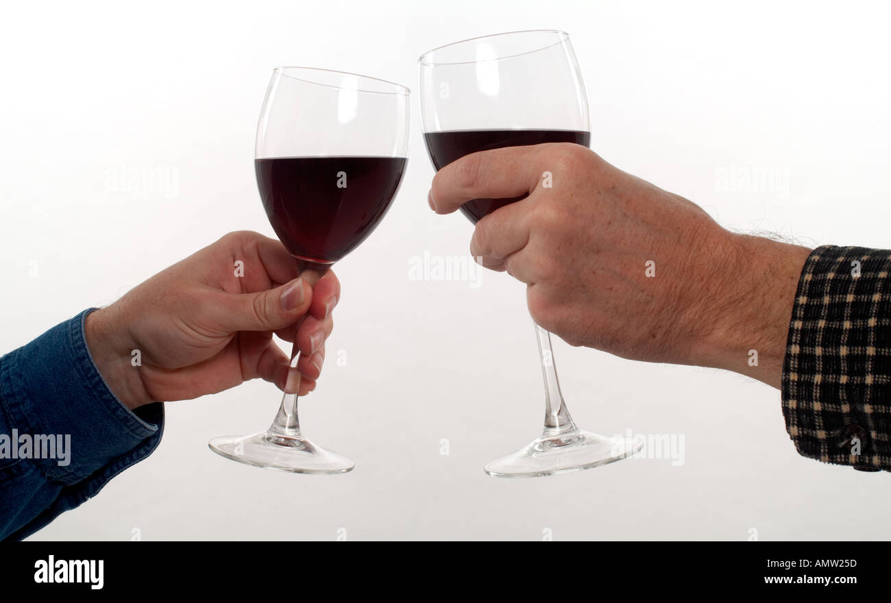 clinking glasses in a toast Stock Photo - Alamy
