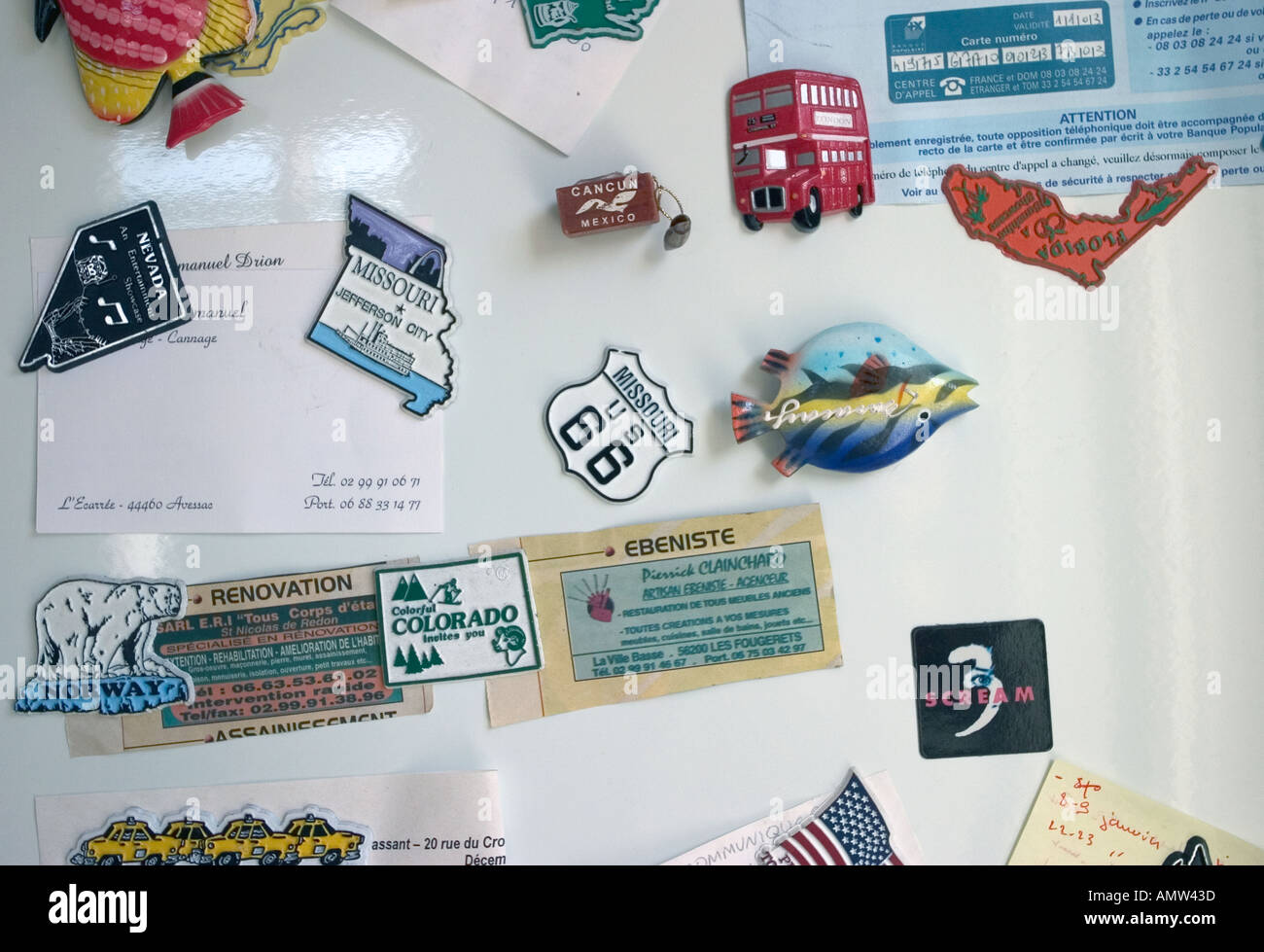 Kitchen fridge with a variety of post it and papers and fridge magnets ...