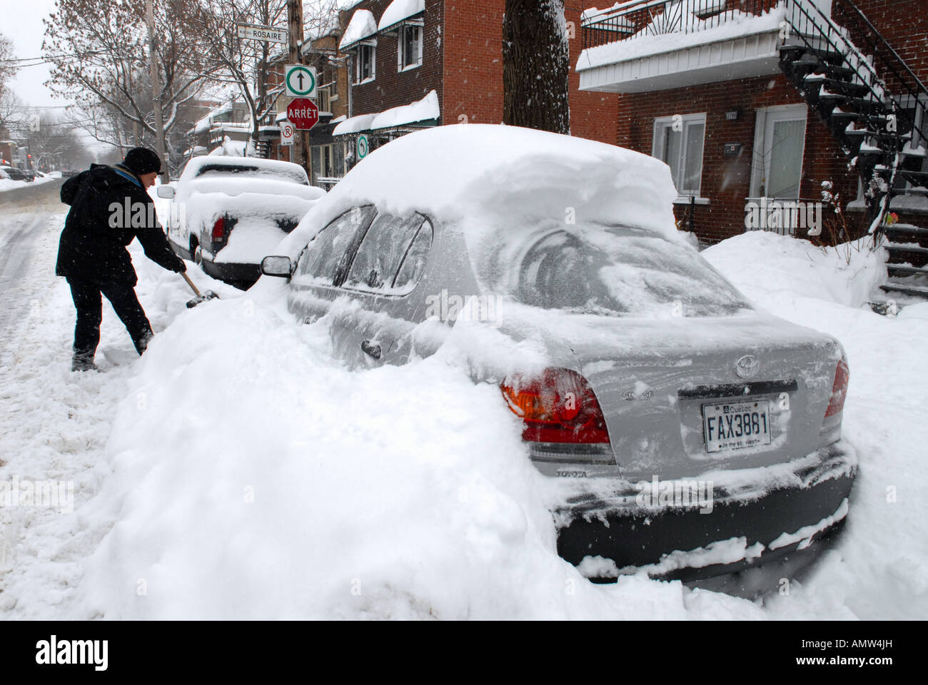 Digging Out A Snow Covered Car