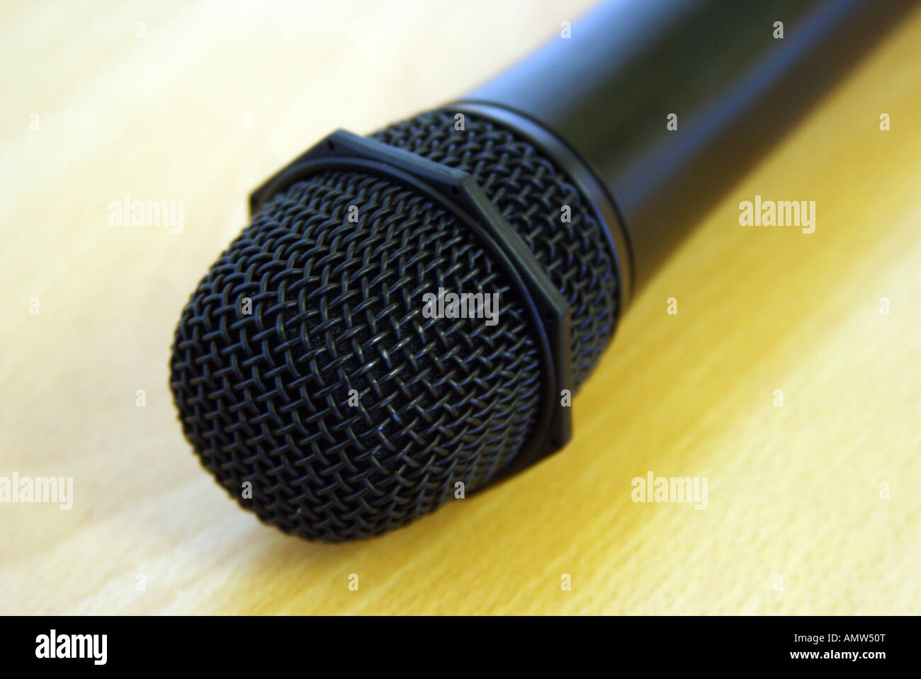 Black microphone on the table Stock Photo - Alamy