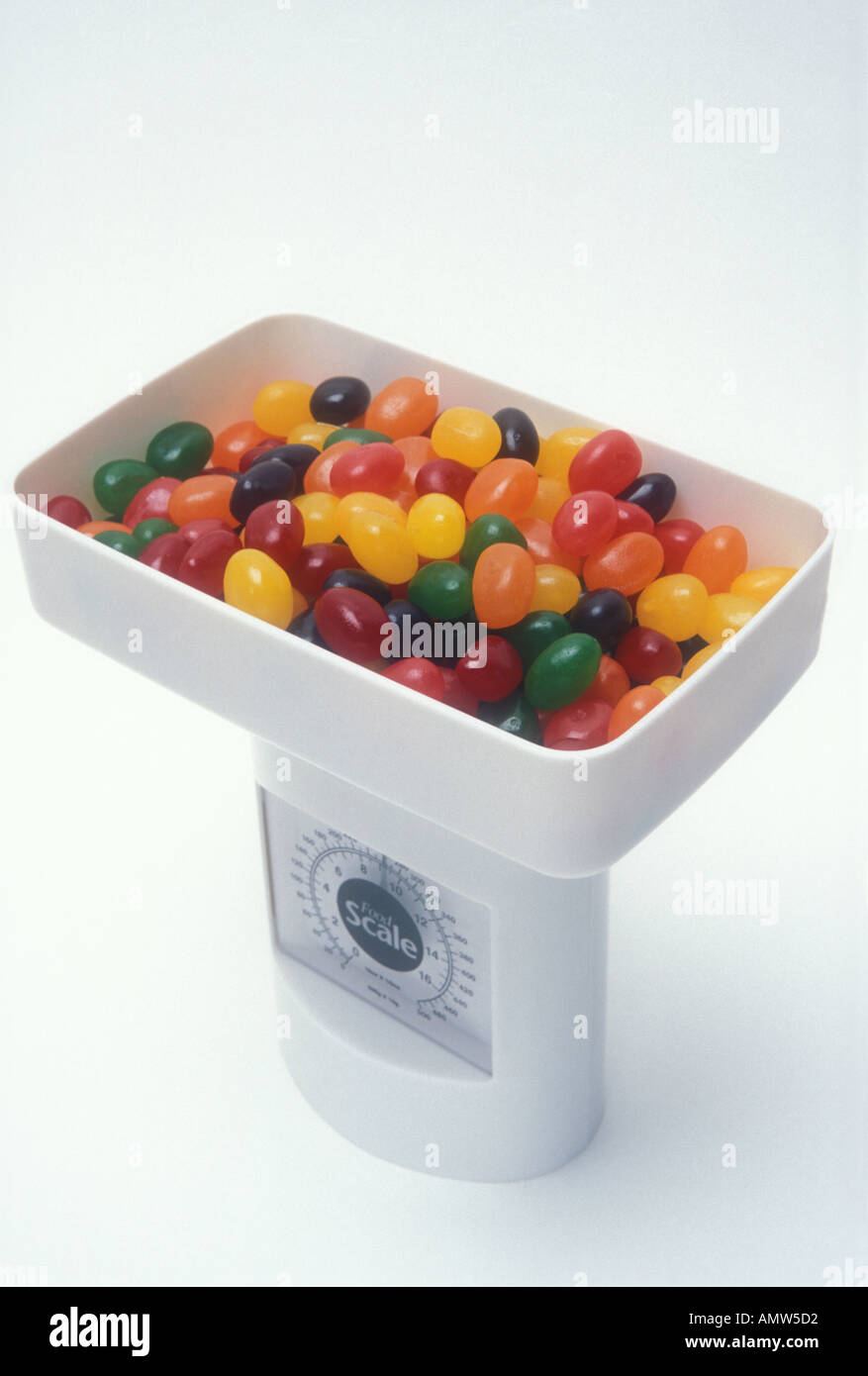 Sweets calories fat salt carbohydrates scale hi-res stock photography ...