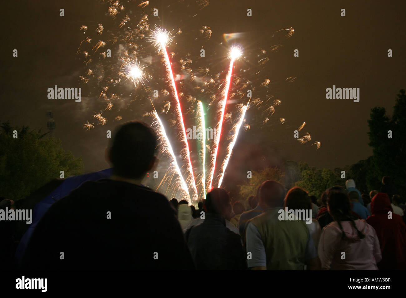 people watching fireworks in the night scene Stock Photo - Alamy