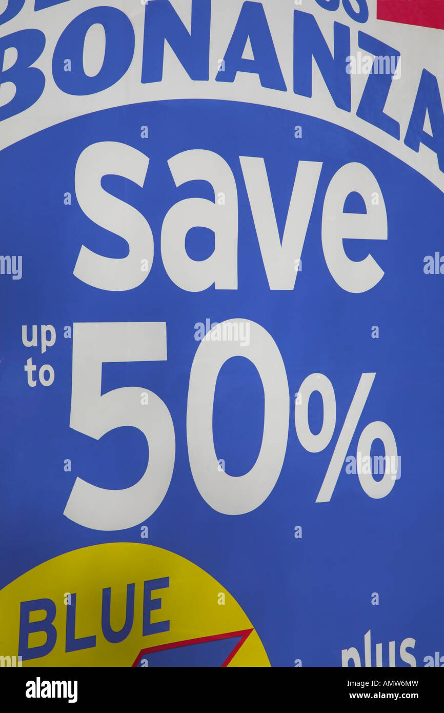 Shop window sign advertising a sale Stock Photo - Alamy