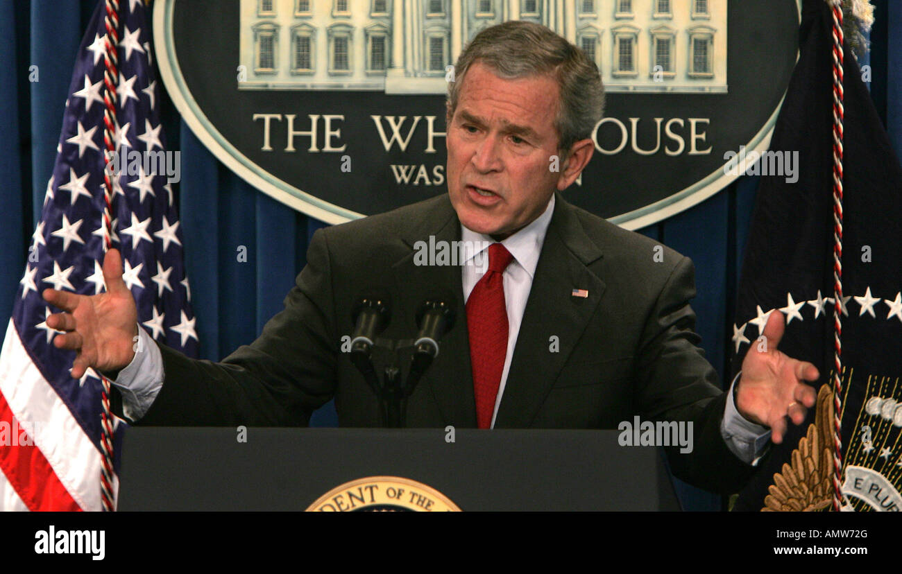 President George W Bush answers a reporter's question at a press ...