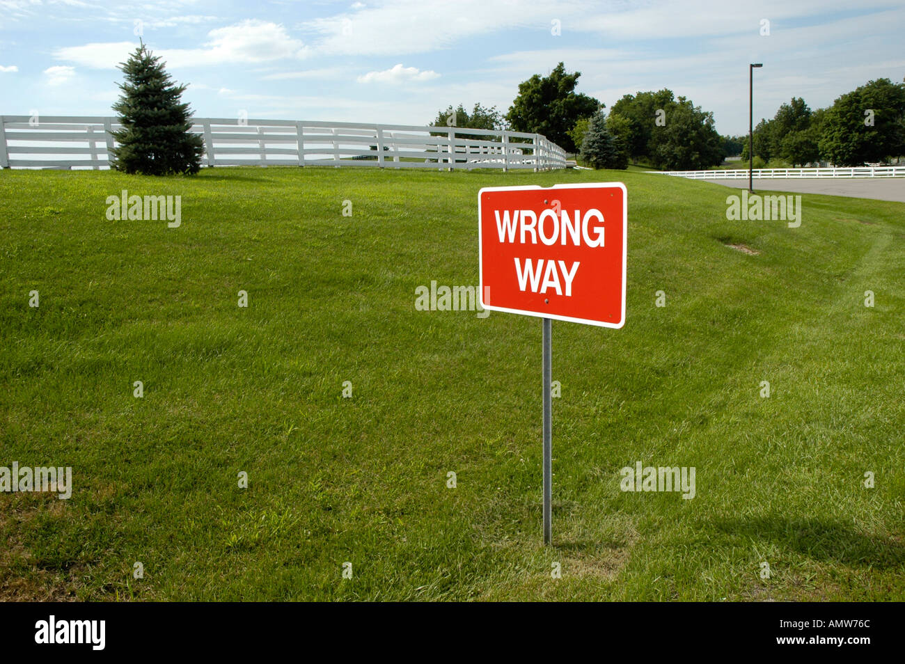 Driving the wrong way on the street sign Stock Photo - Alamy
