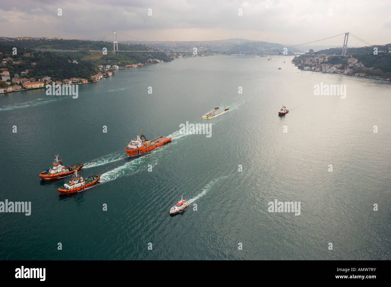 Boats towing a module of a natural gas platform through the Bosphorus ...
