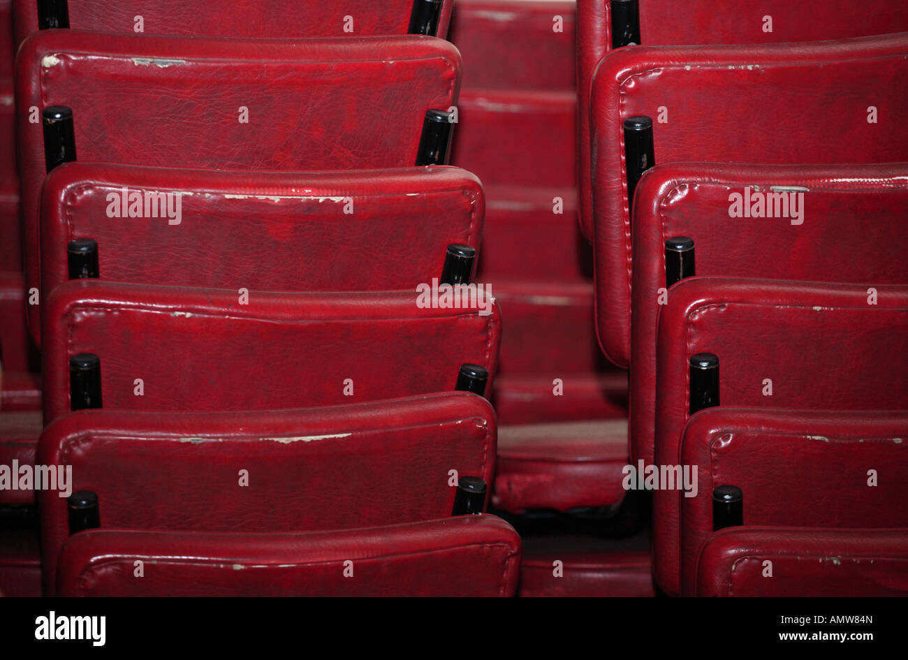 Stacked red plastic chairs Stock Photo - Alamy